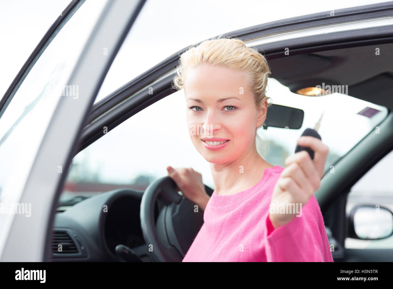 Woman driver showing car keys Stock Photo - Alamy