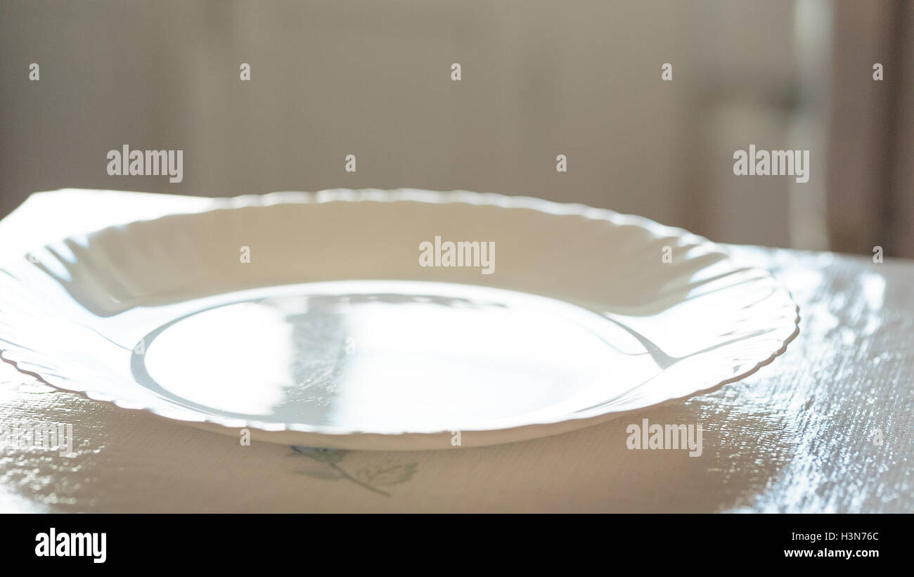 empty plate on the table Stock Photo - Alamy