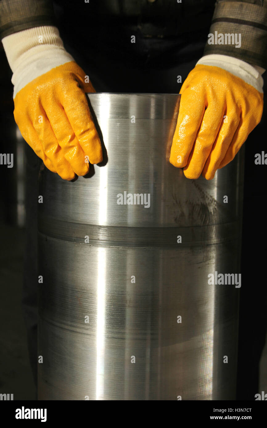 Cylinder and Worker Stock Photo - Alamy
