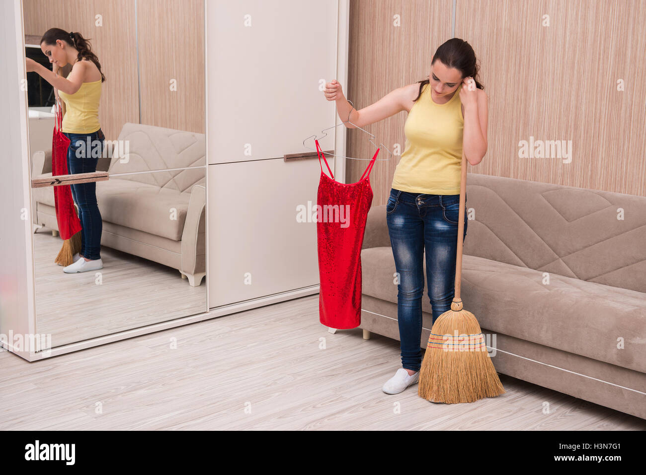 Young woman doing cleaning at home Stock Photo - Alamy