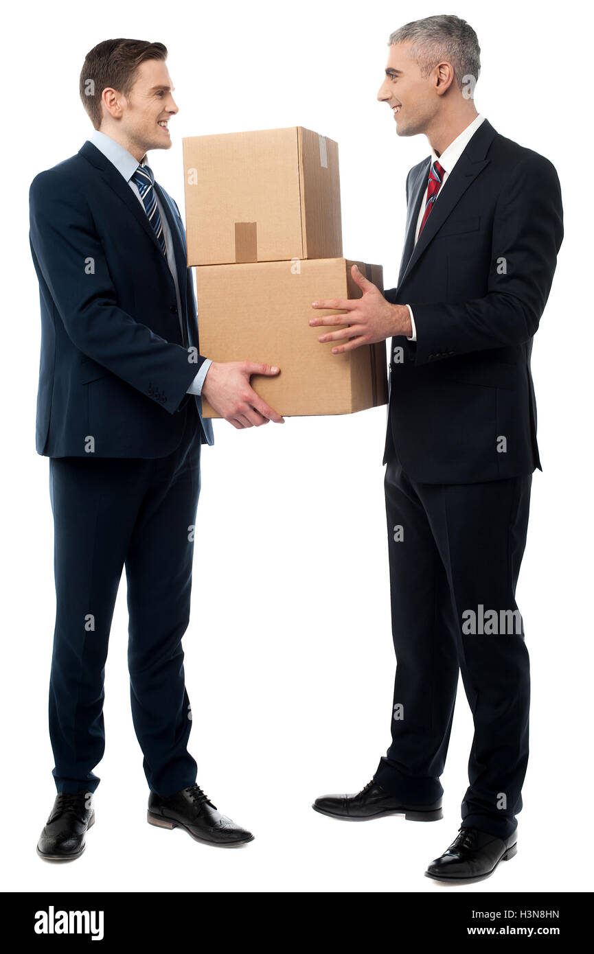 Business men posing with cardboard boxes Stock Photo - Alamy