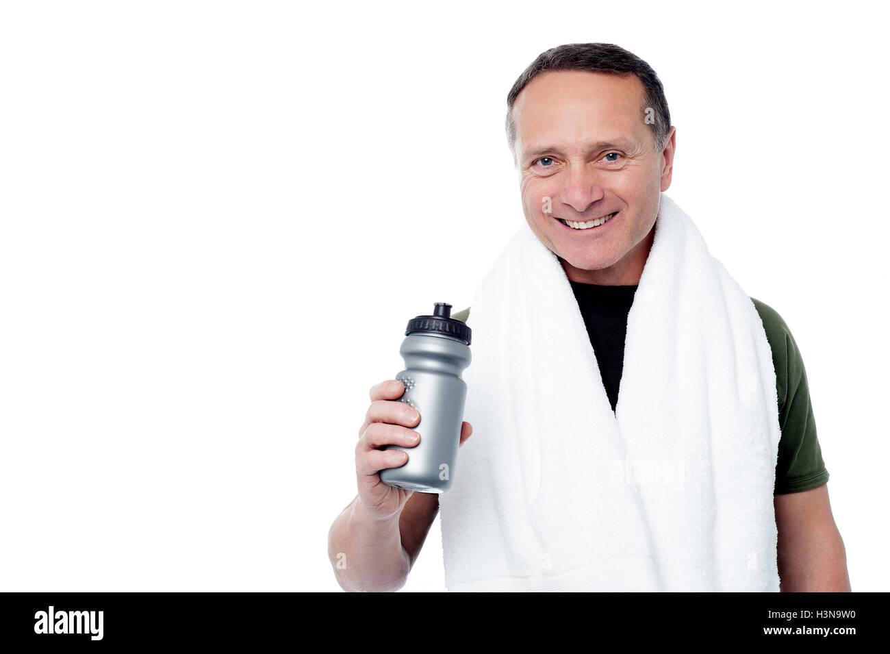 Handsome man holding bottle in hand Stock Photo - Alamy