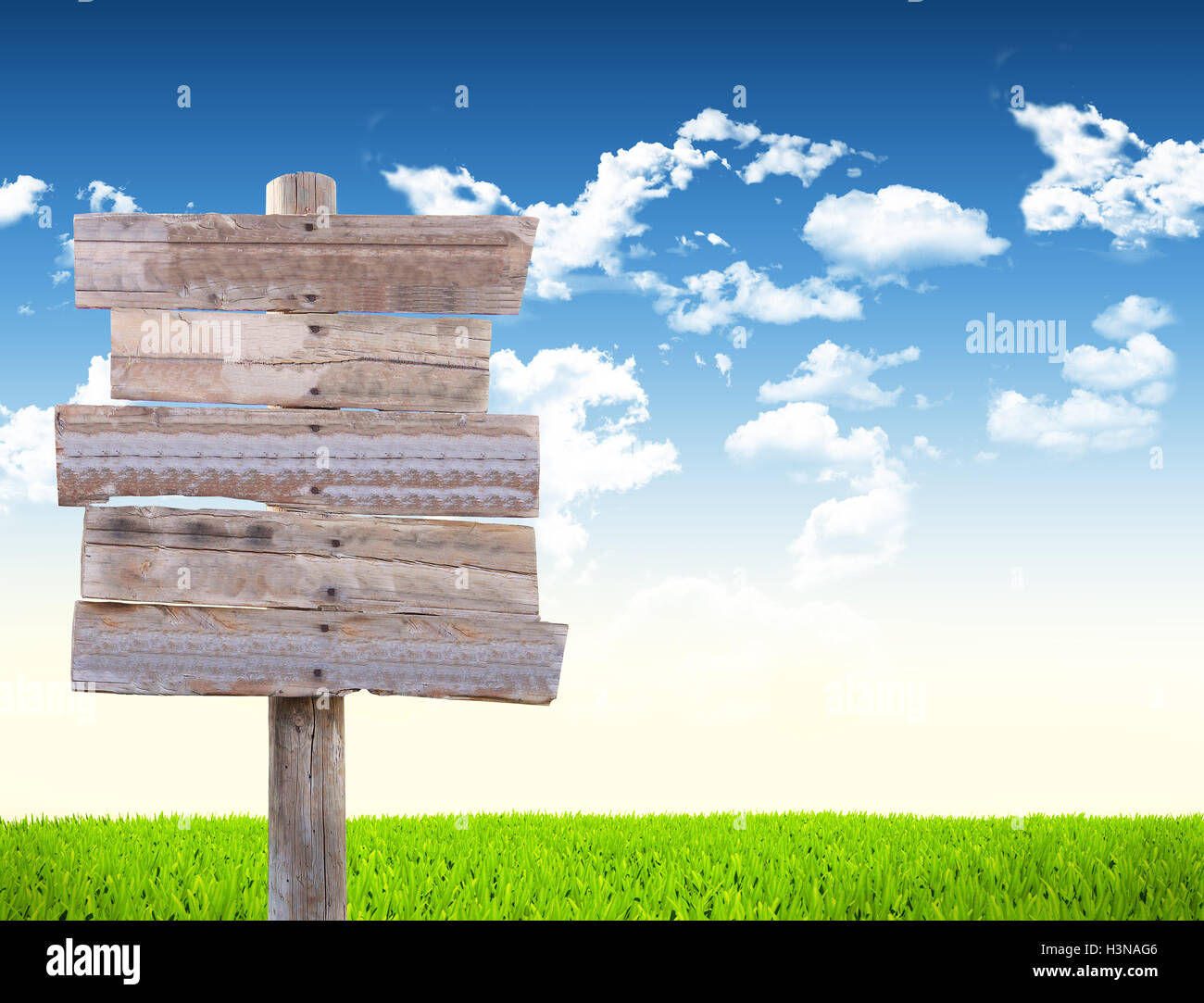 Road sign in green grass field Stock Photo - Alamy