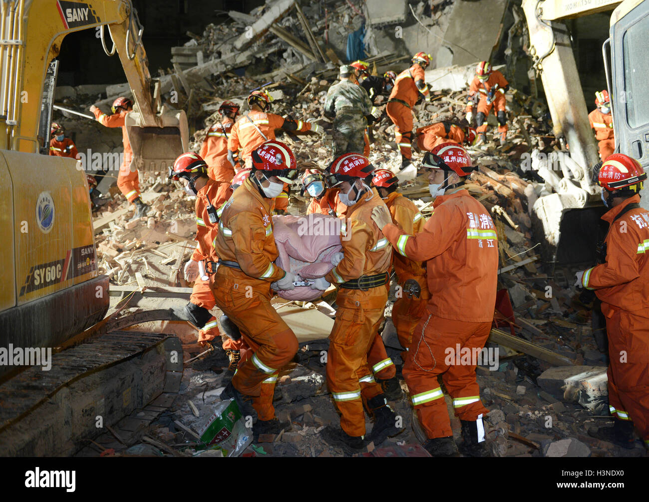 Wenzhou. 11th Oct, 2016. Rescuers carry the body of a victim at the ...