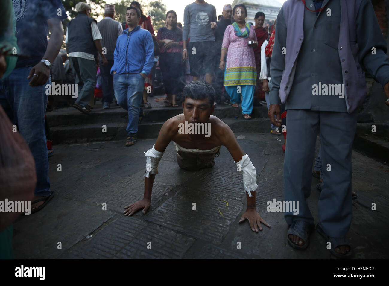 Bhaktapur, Nepal. 11th Oct, 2016. A Nepalese devotee reels on the ...