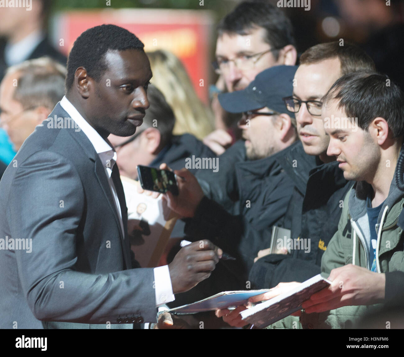 Berlin, Germany. 10th Oct, 2016. The French actor Omar Sy interacts ...