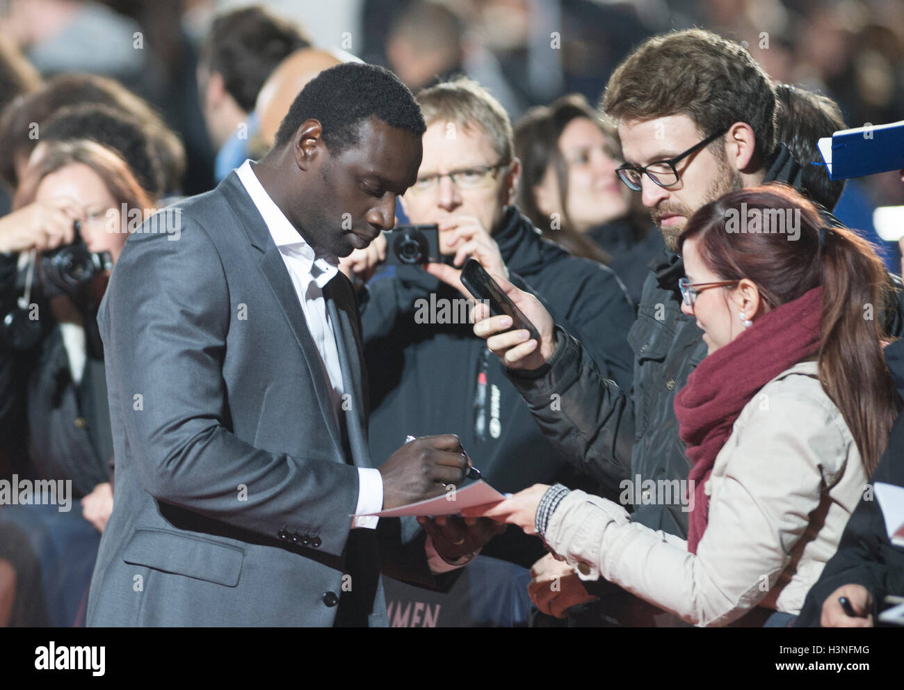 Berlin, Germany. 10th Oct, 2016. The French actor Omar Sy interacts ...