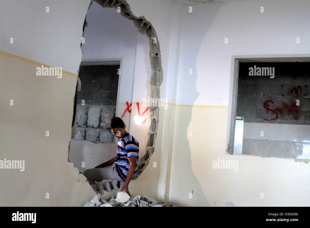 West Bank, Mideast. 11th October, 2016. A Palestinian man examines the ...