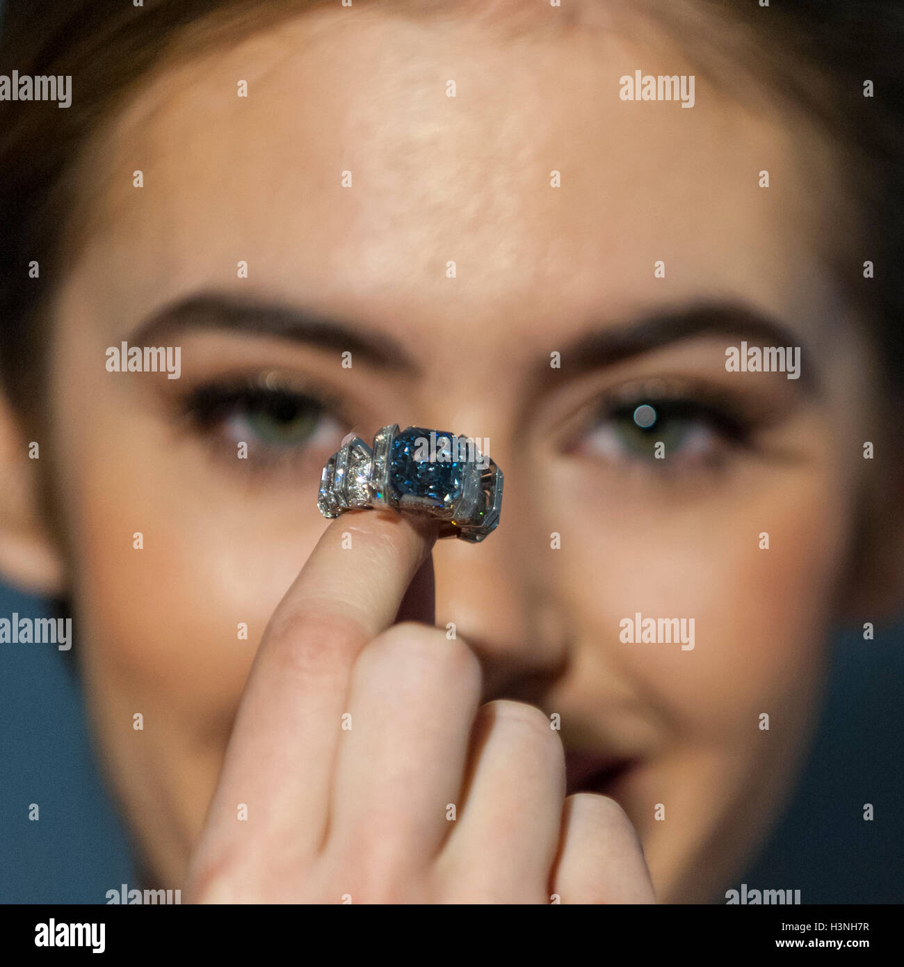 London , UK. 11 October 2016. A model shows a rare fancy vivid blue ...