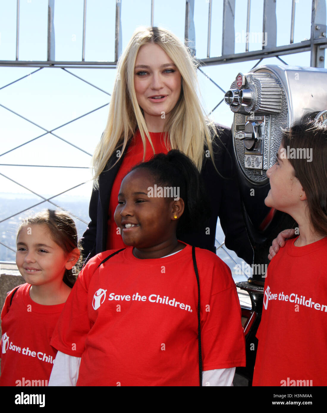 New York, USA. 11th October, 2016. Dakota Fanning lights The Empire ...