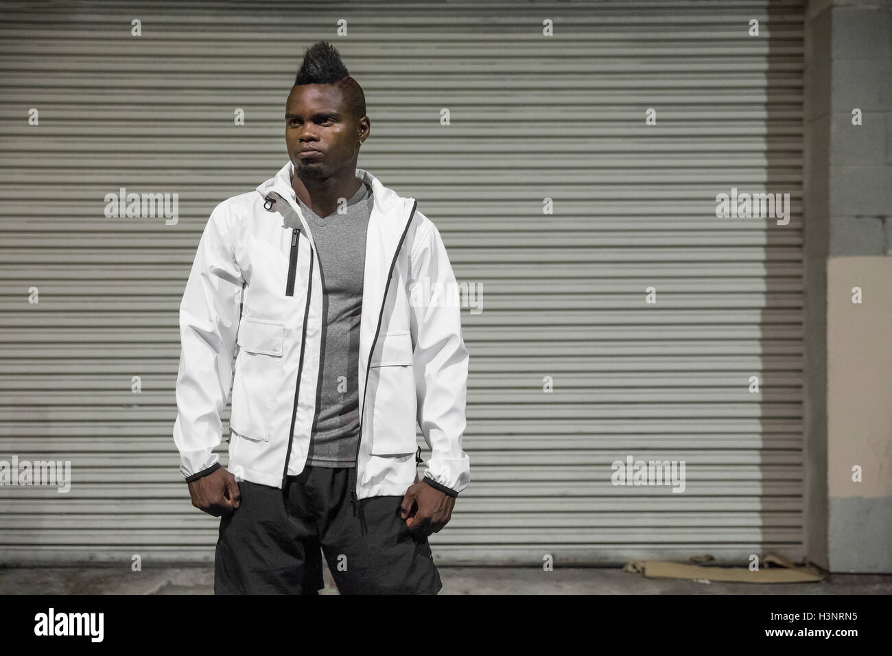 Portrait of young man with mohawk, in urban setting Stock Photo - Alamy