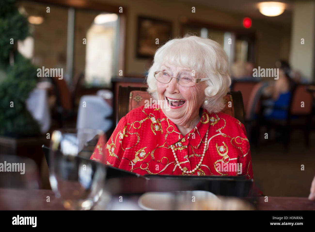 Woman at table in restaurant hi-res stock photography and images - Alamy