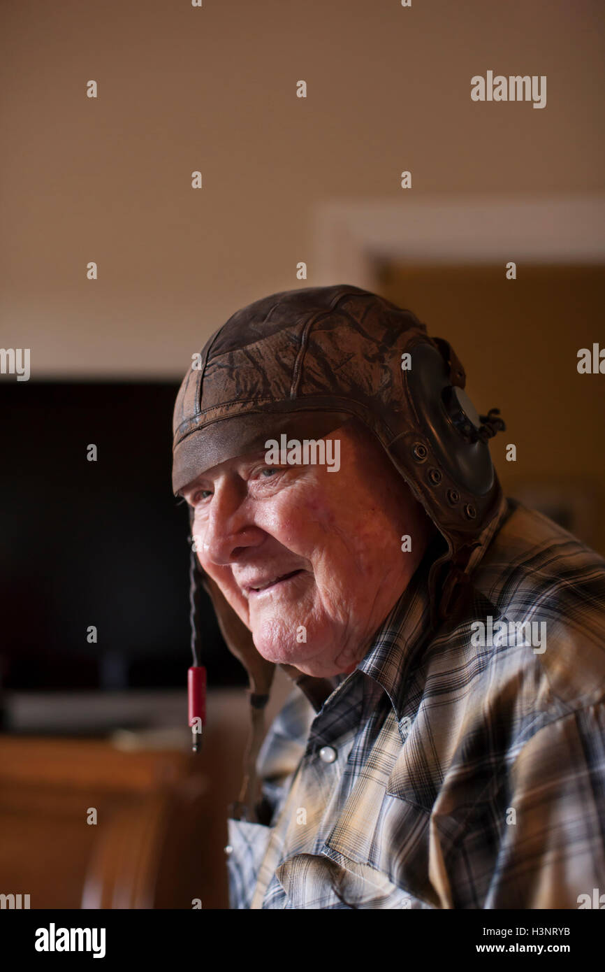 Senior man indoors, wearing old leather football helmet Stock Photo - Alamy