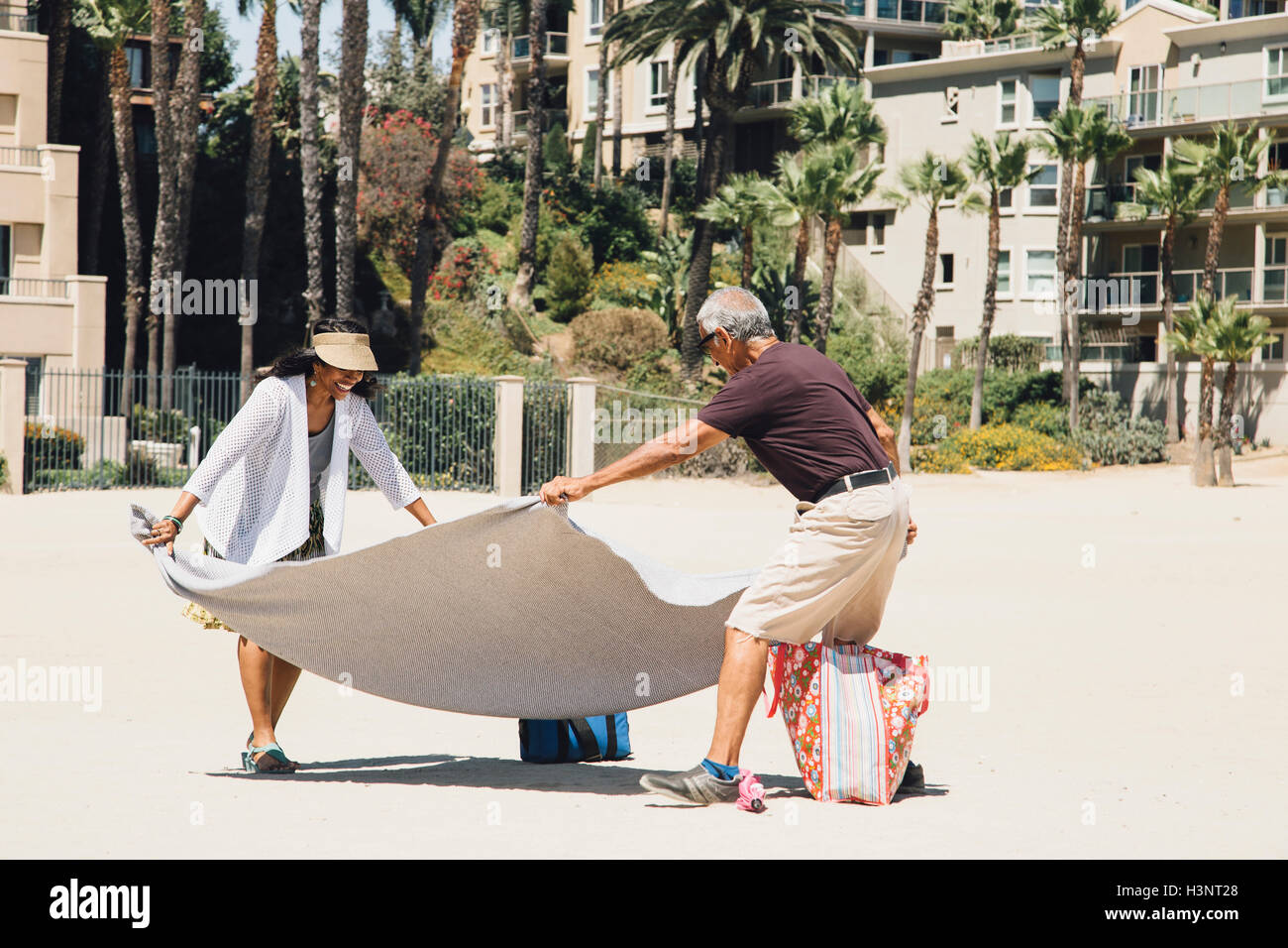 Couple laying on the beach hi-res stock photography and images - Alamy