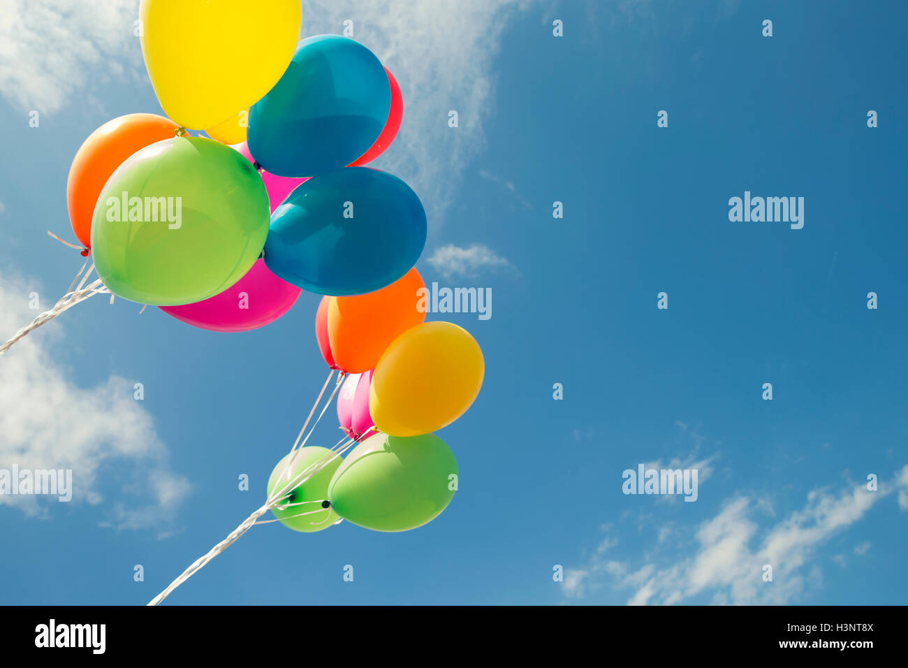 A lot of colorful balloons on a sky background Stock Photo - Alamy