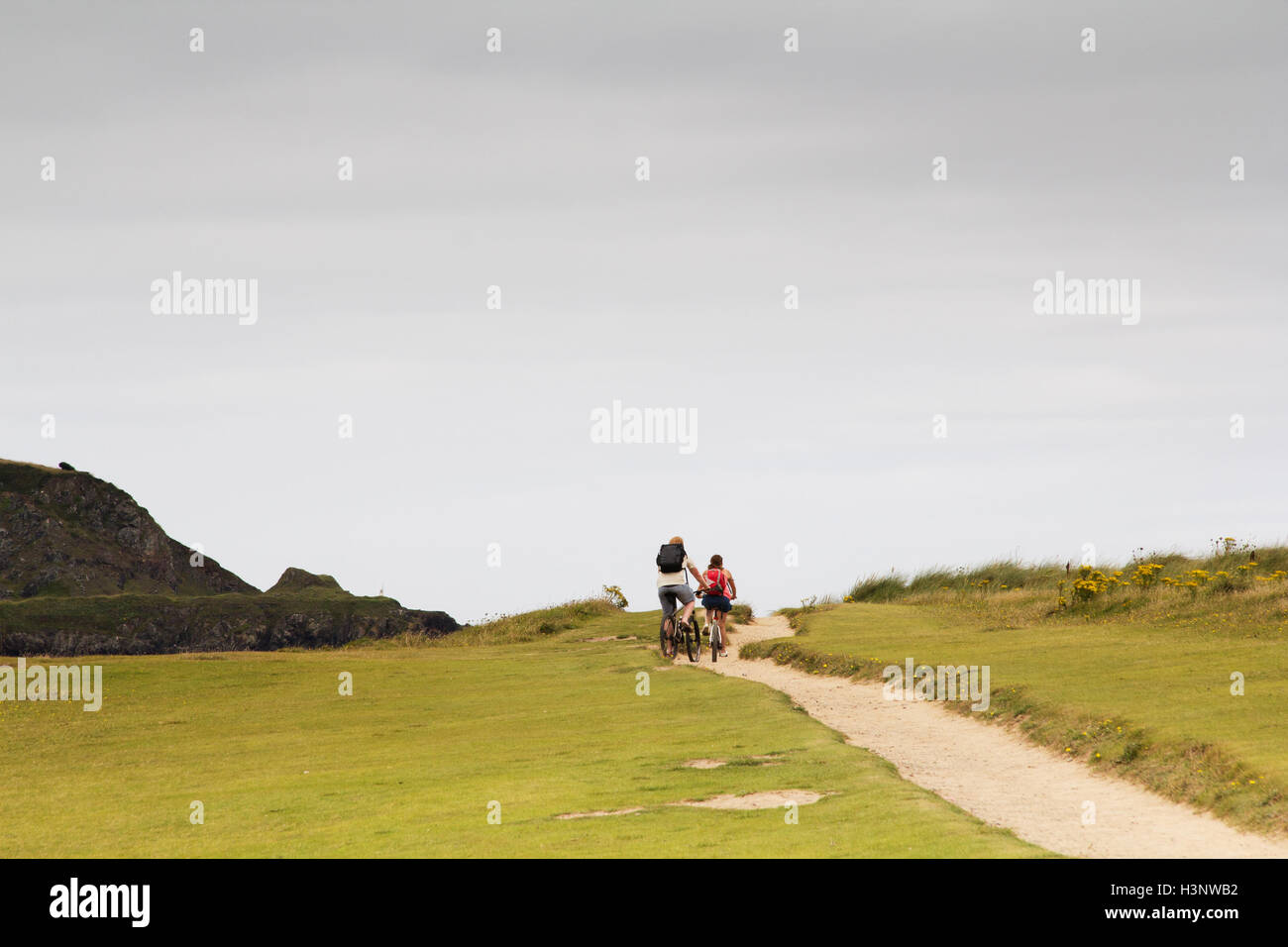 Cyclists on a costal path in Cornwall, England Stock Photo - Alamy