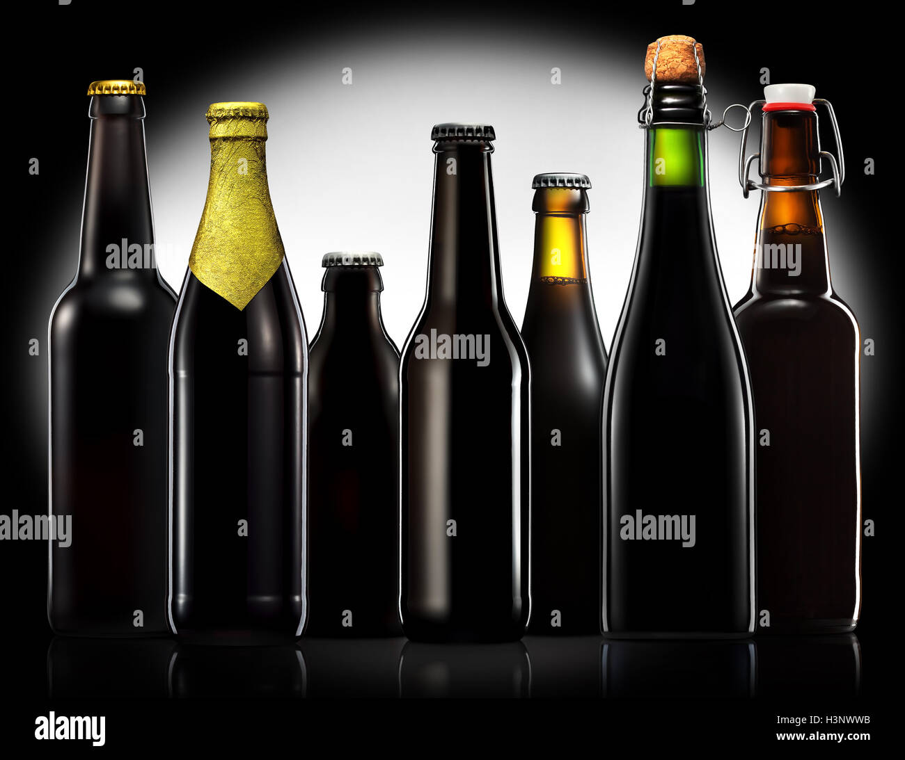 Set of beer bottles isolated on black background Stock Photo - Alamy