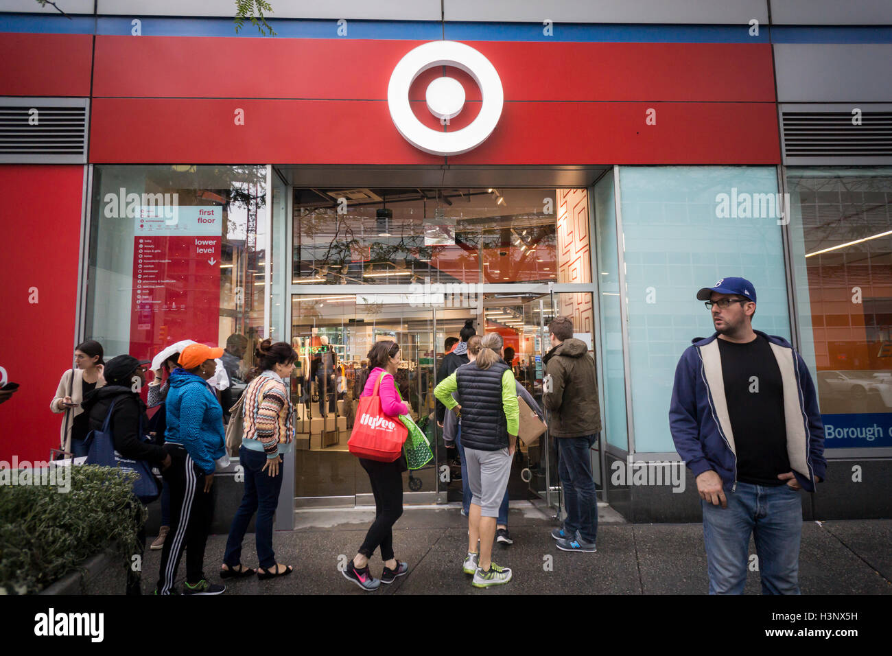 Customers enter and leave the new Target smaller store in the Tribeca ...