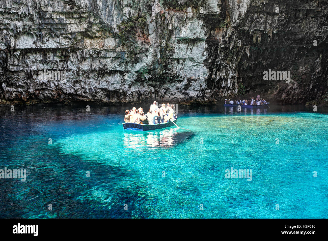 The tour in the cave of Melissani lake in Kefalonia island, Greece ...