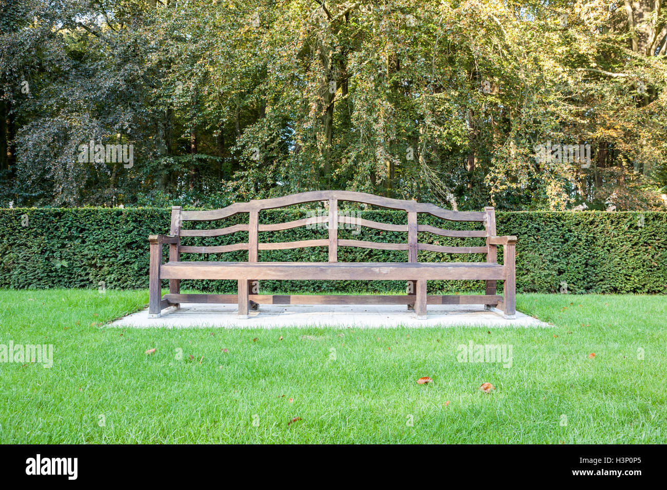 in the cemetery there is a free large wooden bench Stock Photo - Alamy