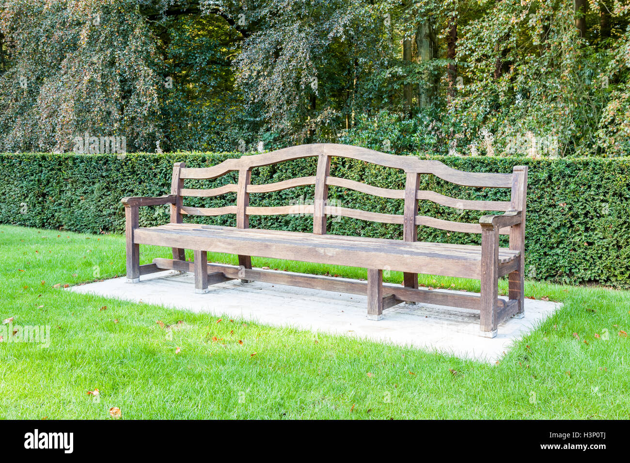 in the cemetery there is a free large wooden bench Stock Photo - Alamy
