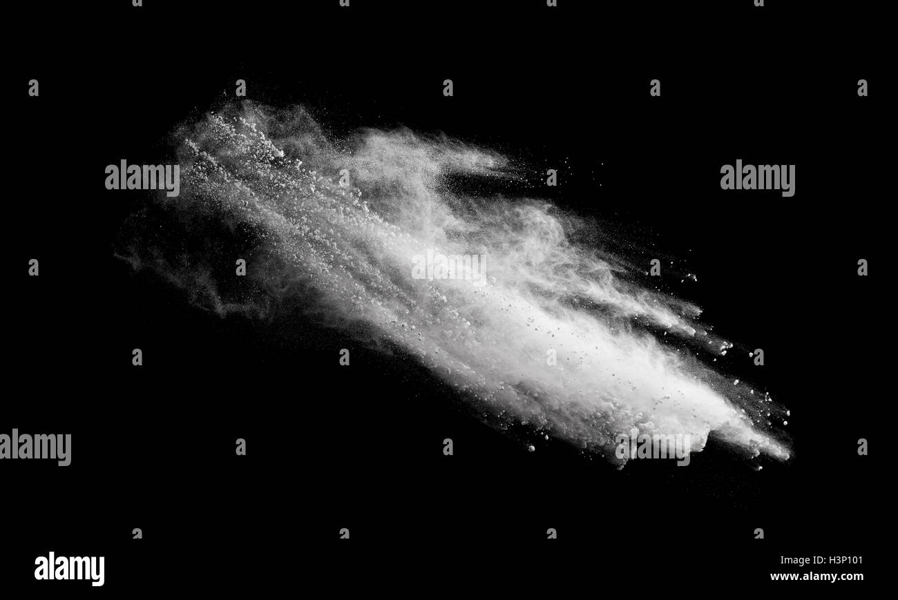 Freeze motion of white dust explosion isolated on black background ...