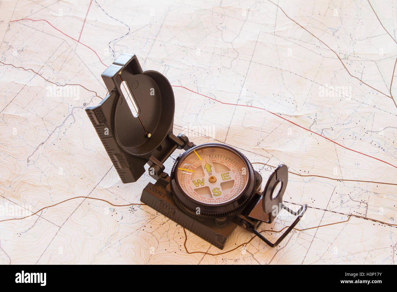 Compass on map Stock Photo - Alamy