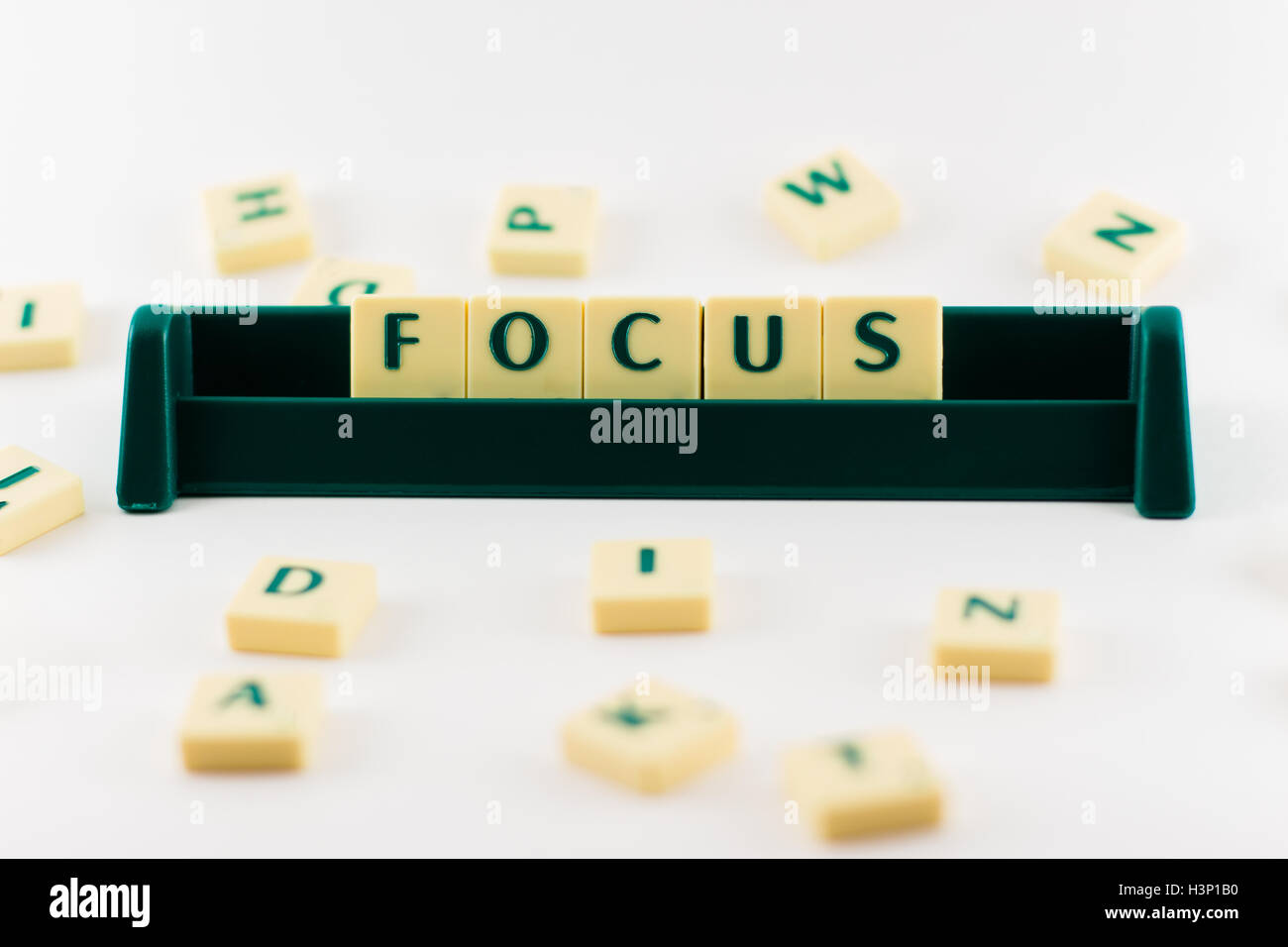 Letters forming the word FOCUS put in a container Stock Photo - Alamy