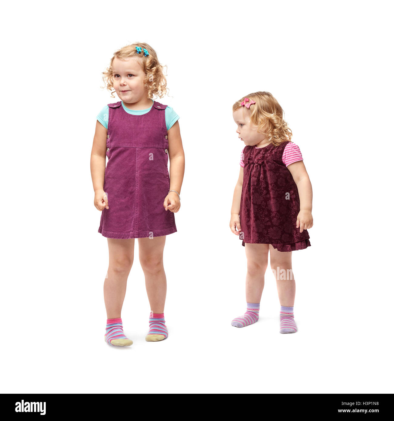 Couple young little girls standing over isolated white background Stock ...