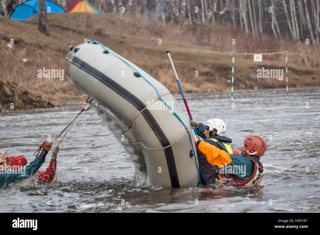 Athletes work actions when capsizing raft Stock Photo - Alamy