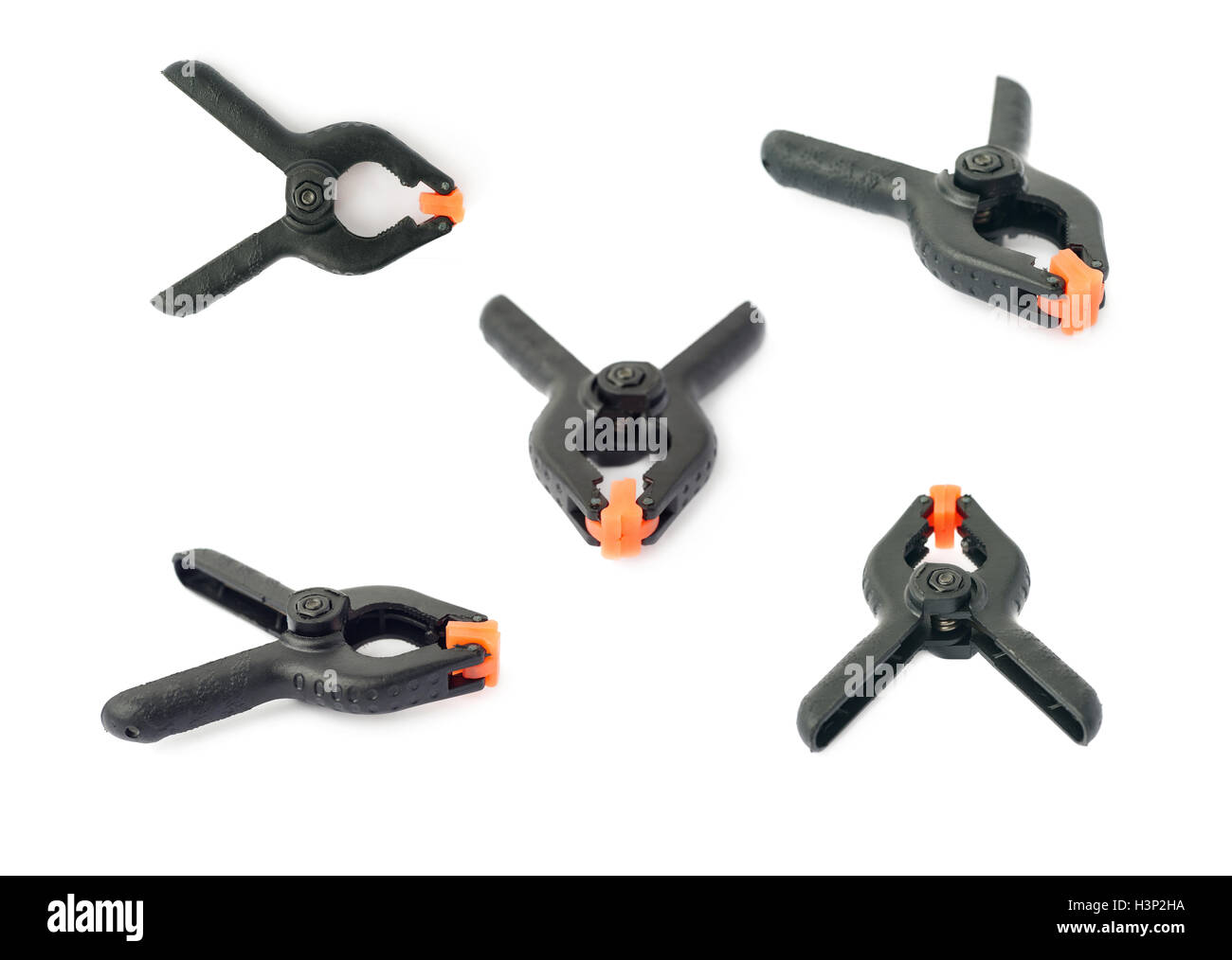 Set of Clamp with orange plastic jaws, isolated over the white ...