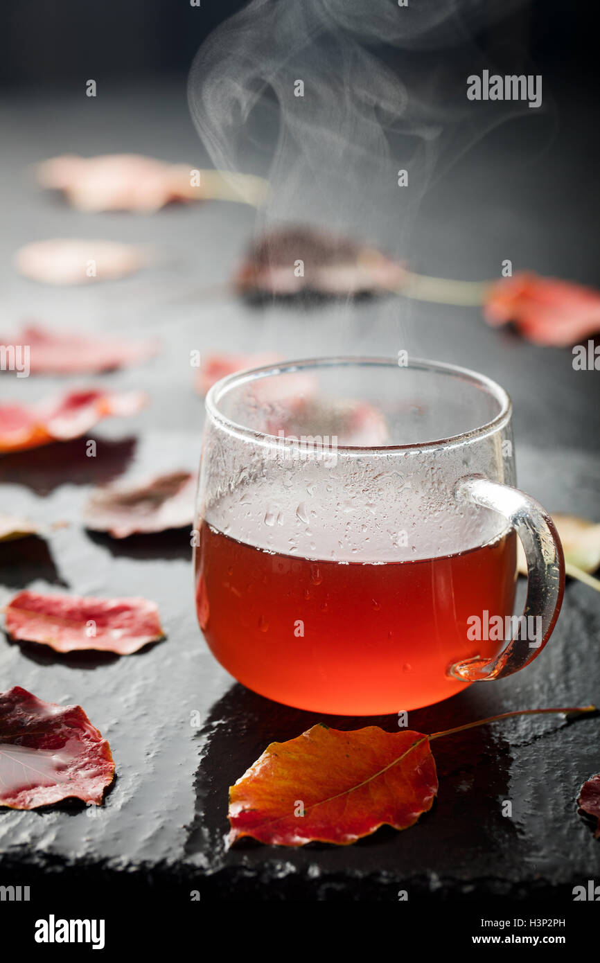 Cup of tea, autumn leaves Wet stone background Stock Photo - Alamy