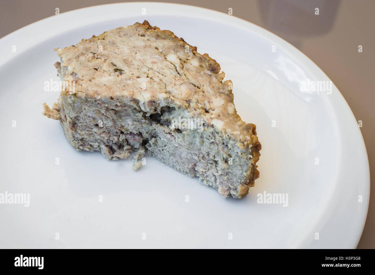 rabbit pate in white plate Stock Photo - Alamy