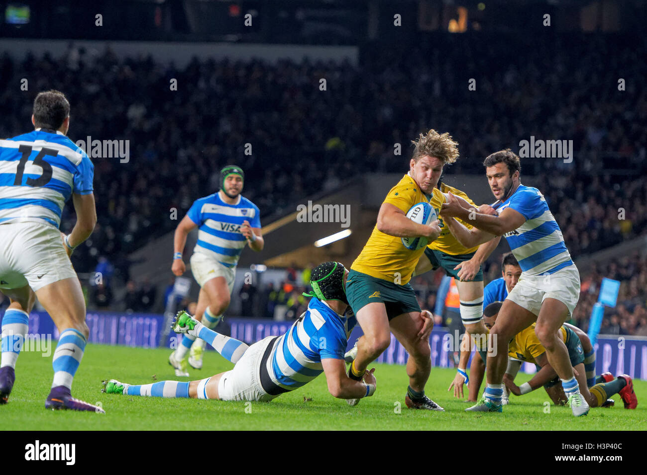 Australia's Michael Hooper (7) fends off a tackle during the rugby ...
