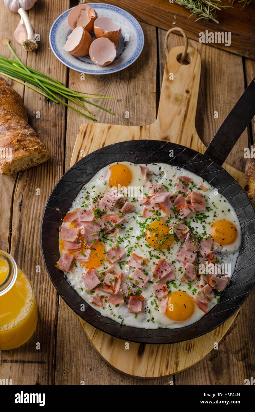Ham and egg omelet with herbs and rustic baquette Stock Photo - Alamy