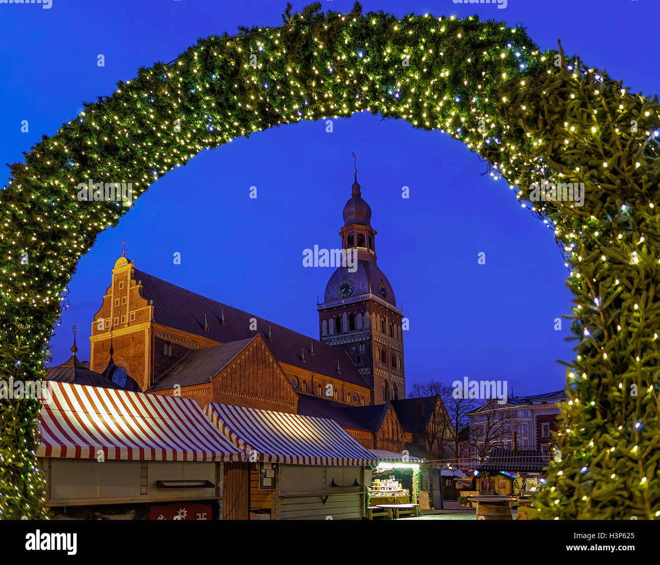 Entrance to the Christmas market and Riga Cathedral at night in old ...
