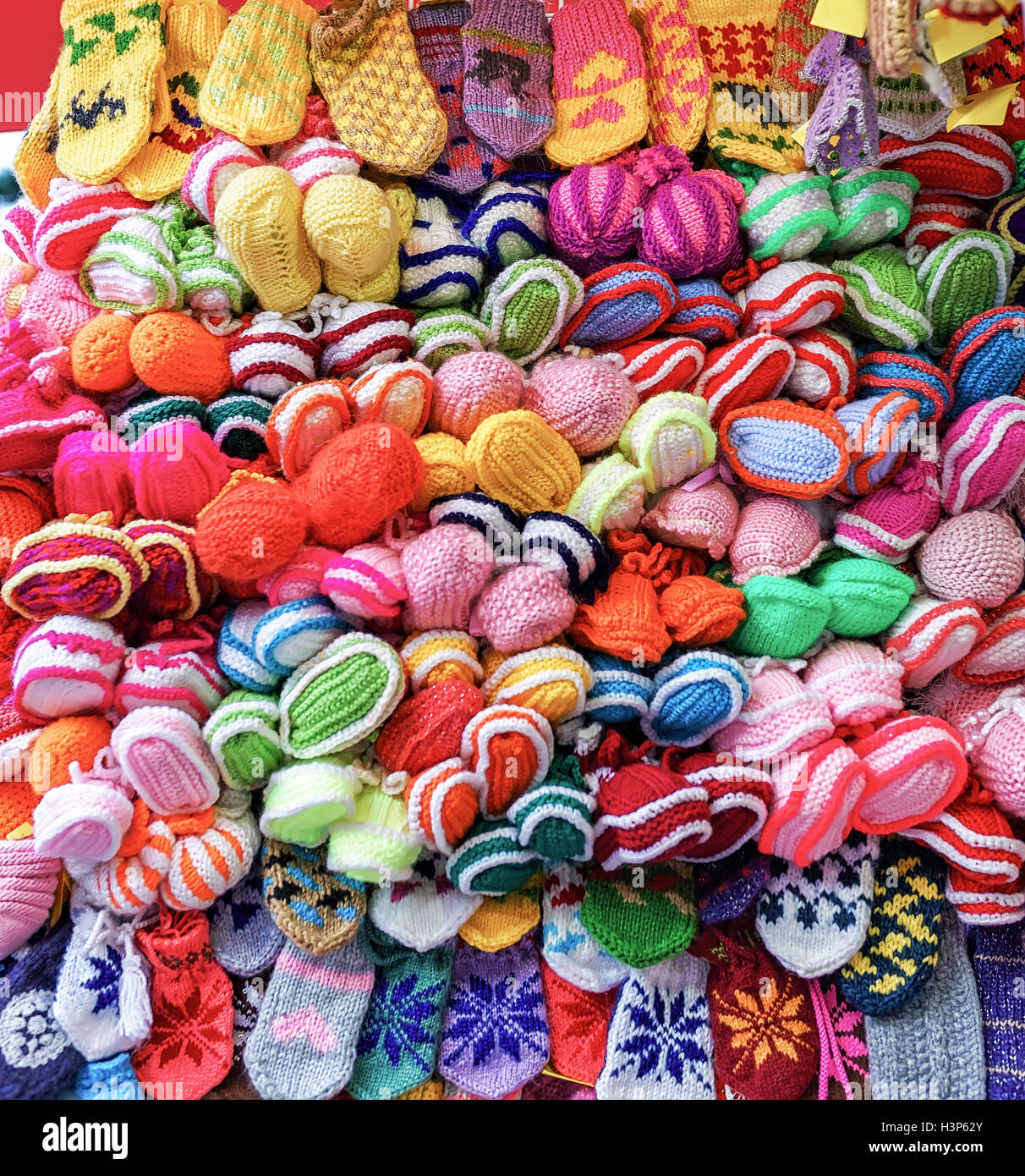 Huge amount of colorful mittens and gloves displayed for sale at the ...