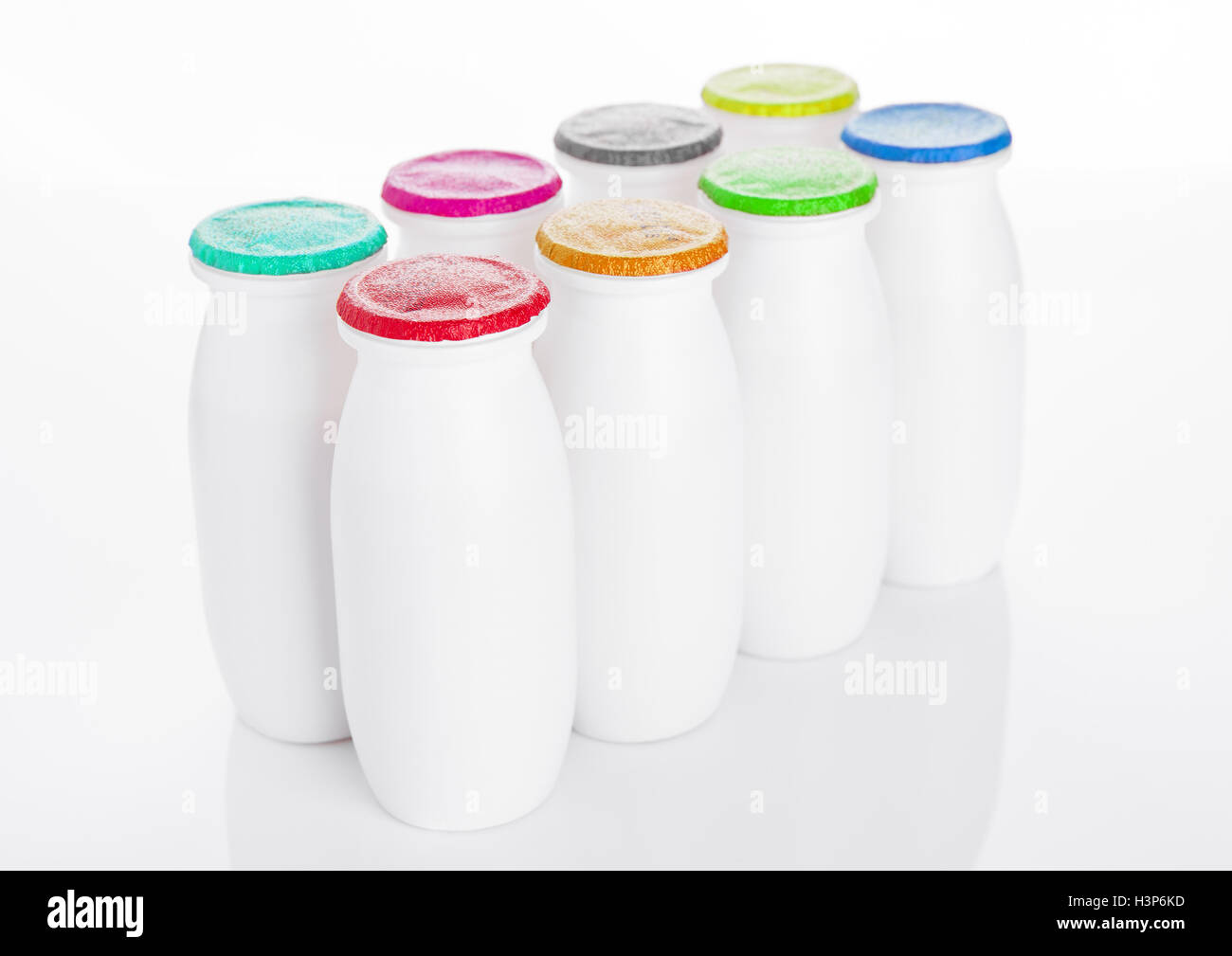 Yogurt containers healthy vitamin drink on white background Stock Photo ...