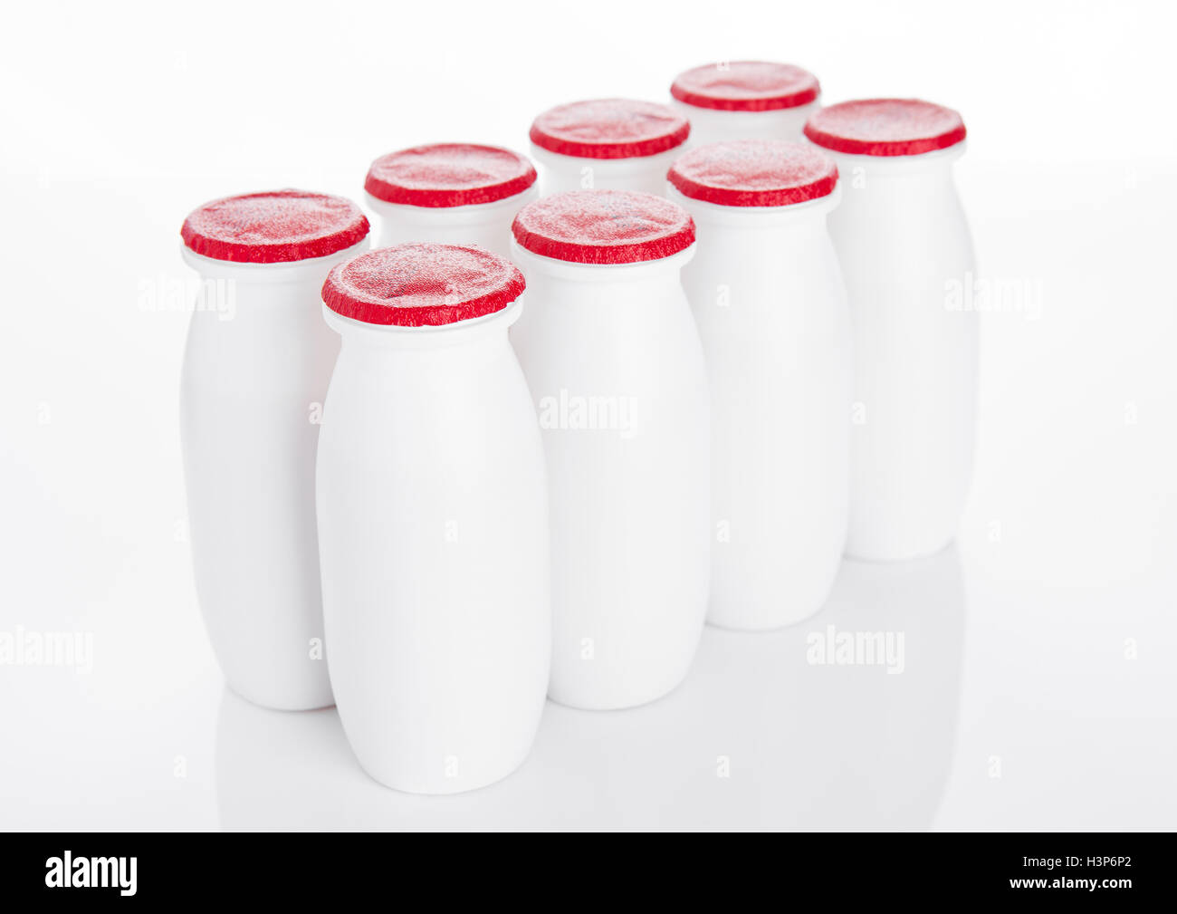 Yogurt containers healthy vitamin drink on white background Stock Photo ...