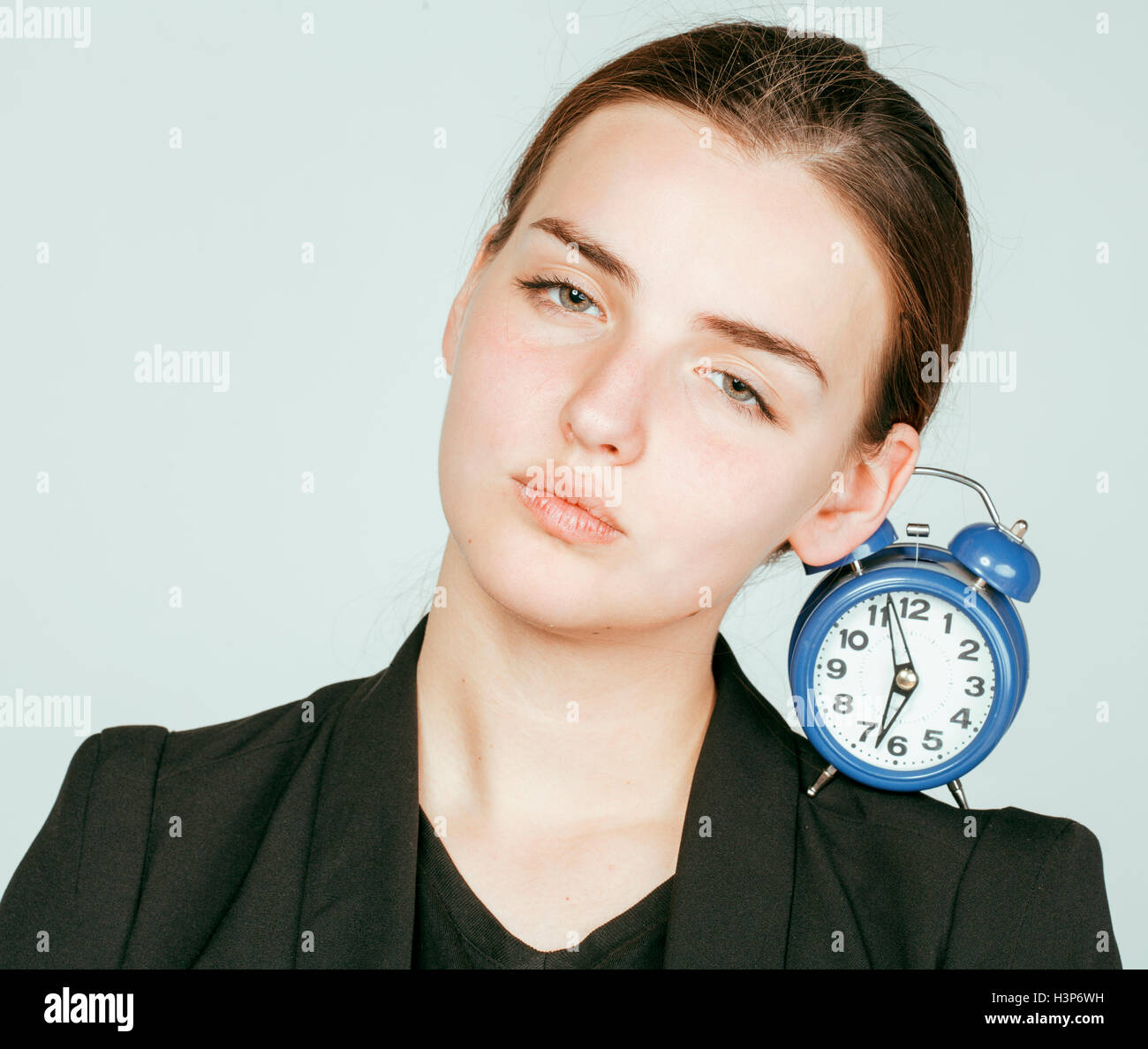 young beauty woman in business style costume waking up for work early ...