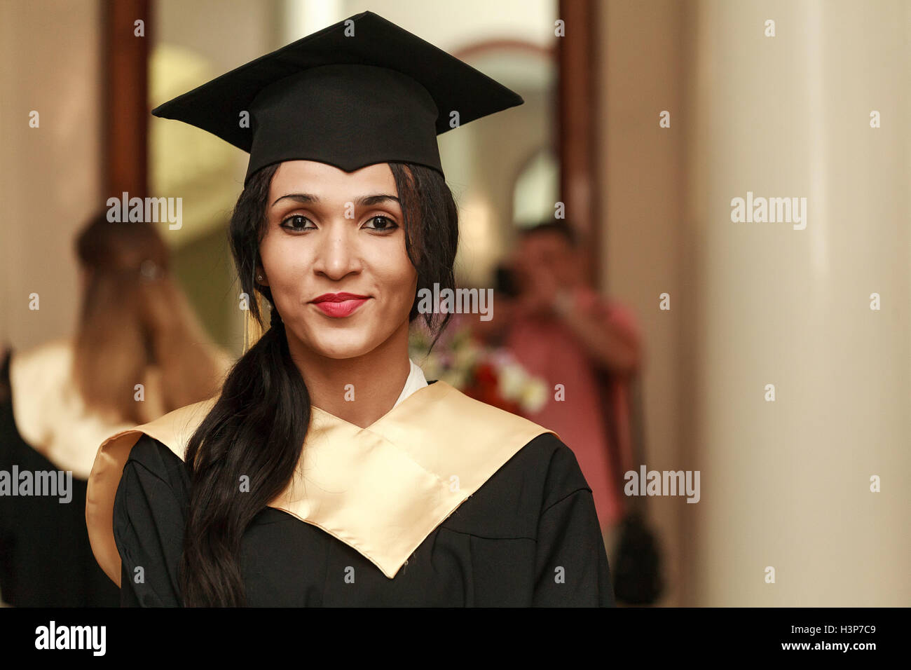 Graduate students wearing graduation hat Stock Photo - Alamy