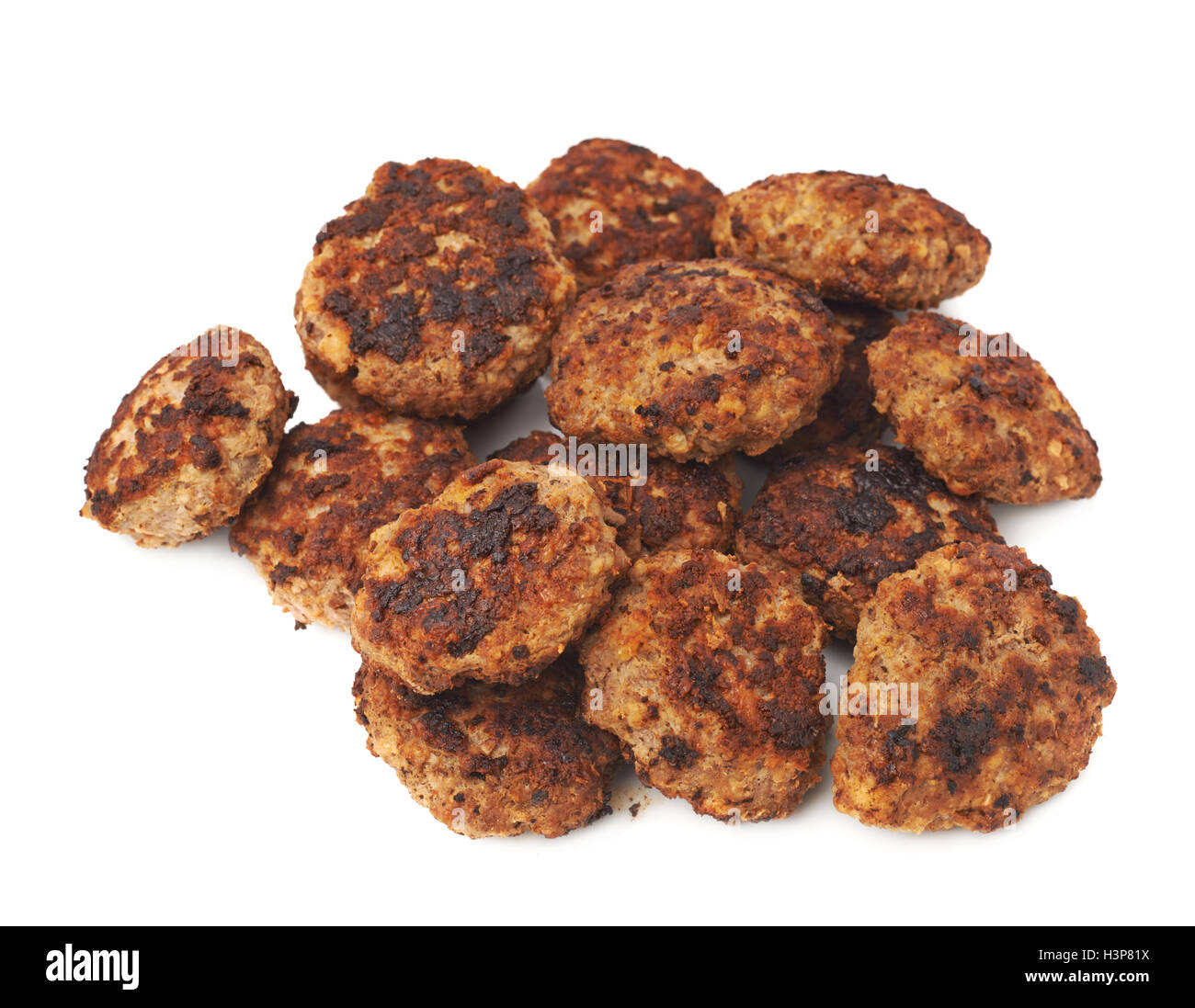 Pile of small hand made cutlets isolated over white background Stock ...