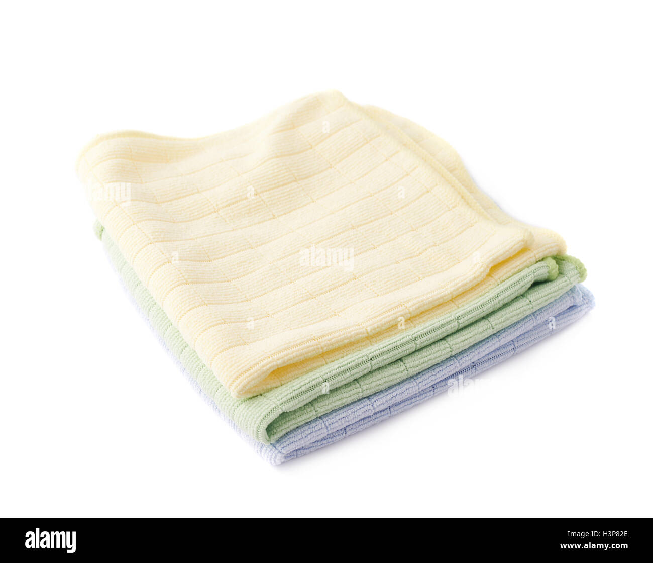 Pile of folded rags over white isolated background Stock Photo - Alamy