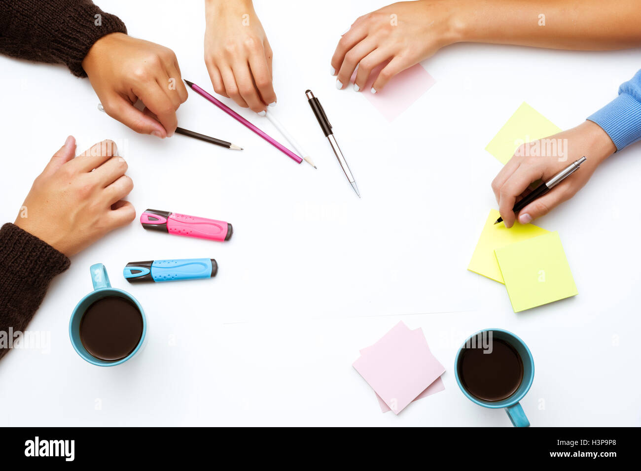 Group of people hands table work space concept Stock Photo - Alamy