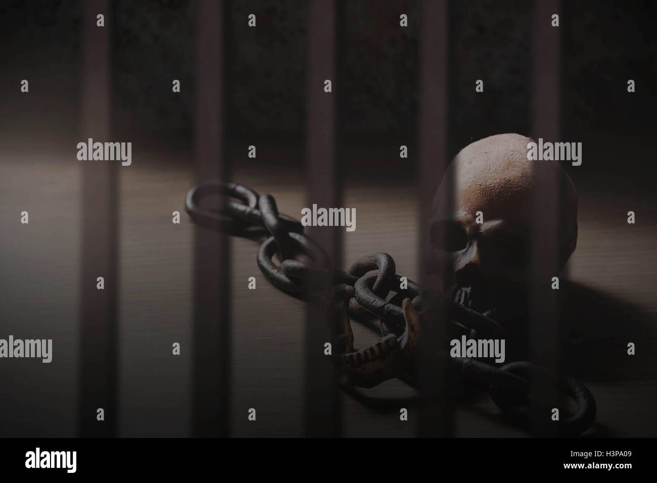 Skulls and chains confined within the prison Stock Photo - Alamy