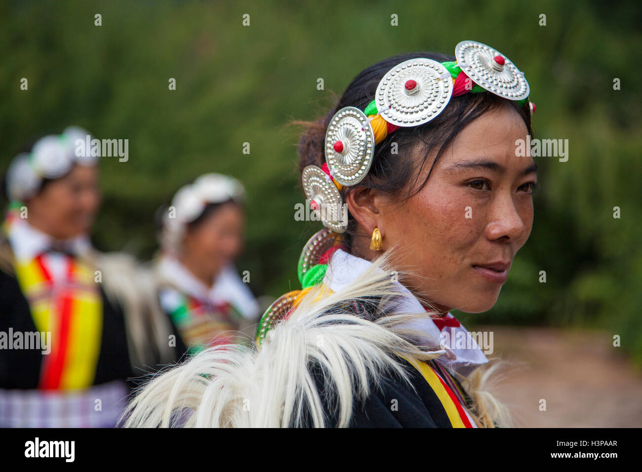 Naxi people in folk costumes dancing tribal dances, Yunnan, China Stock ...