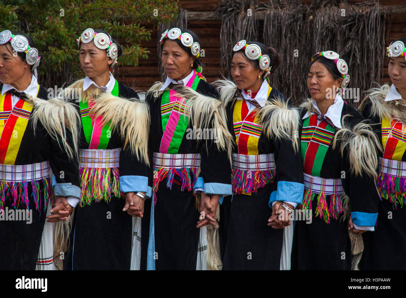 Naxi people in folk costumes dancing tribal dances, Yunnan, China Stock ...