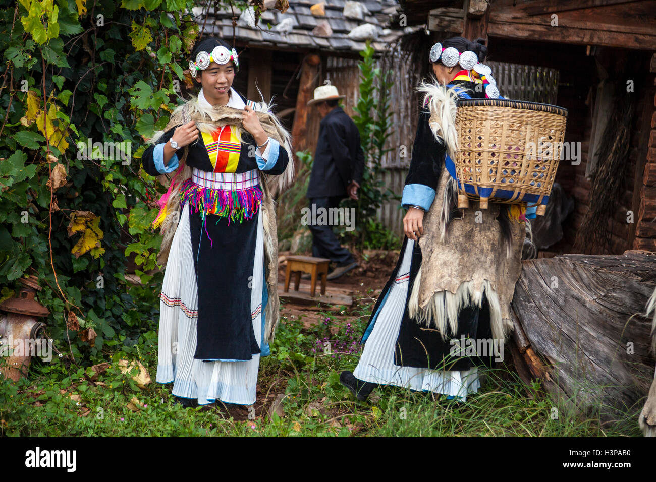 Naxi people in folk costumes showing everyday life Yunnan, China Stock ...