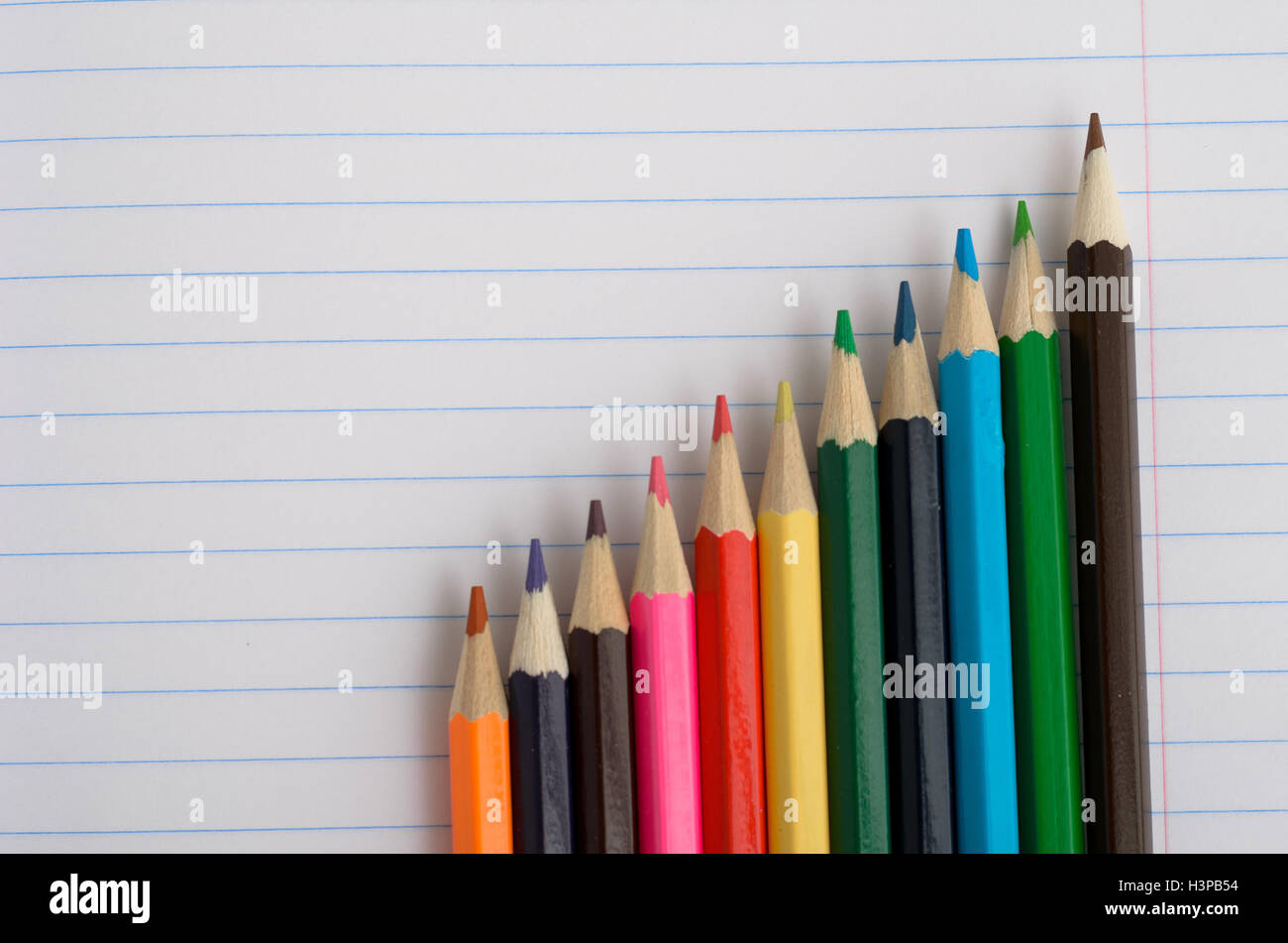 Colored pencils and paper Stock Photo - Alamy