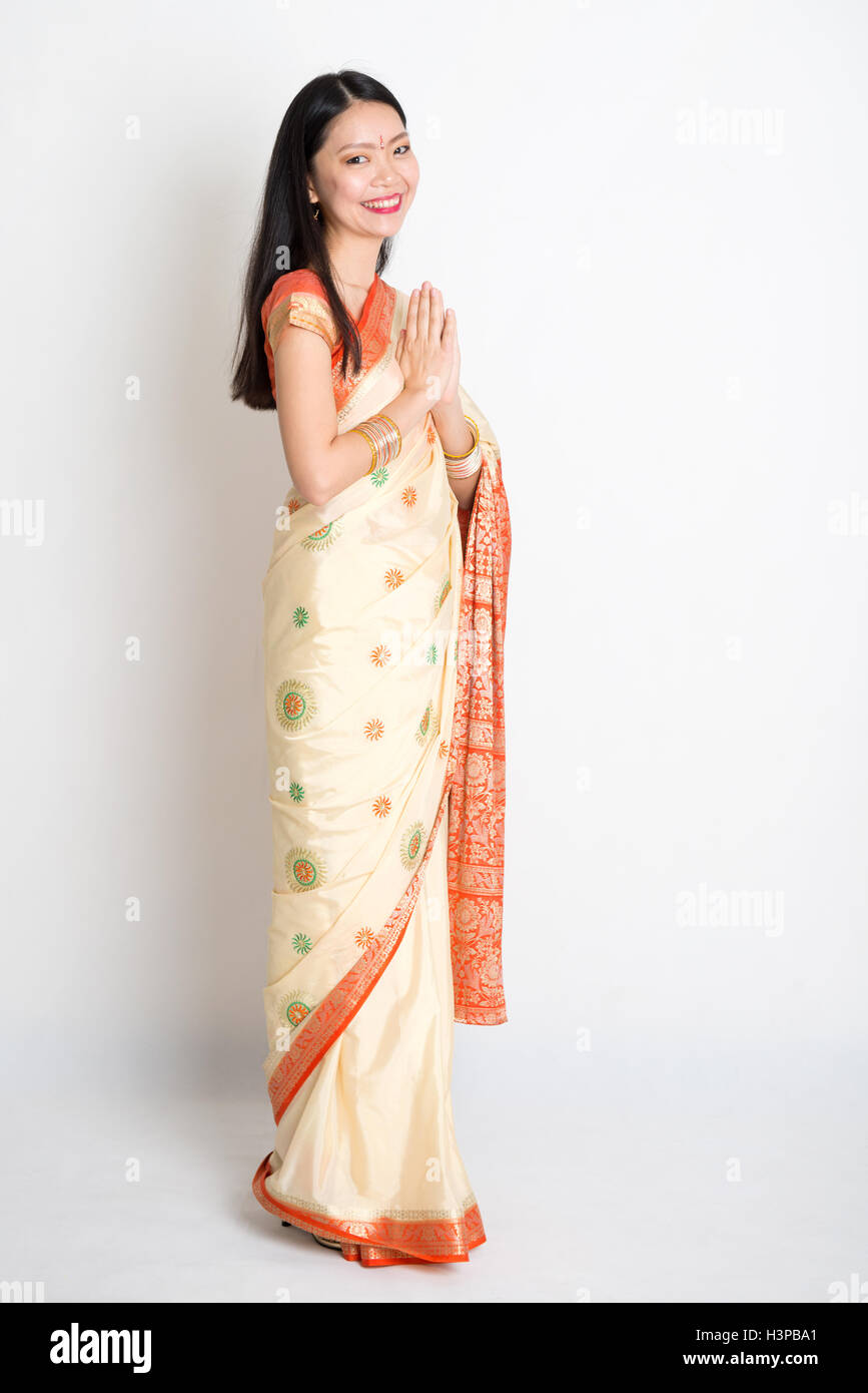 Full length mixed race Indian Chinese girl with sari dress in greeting ...